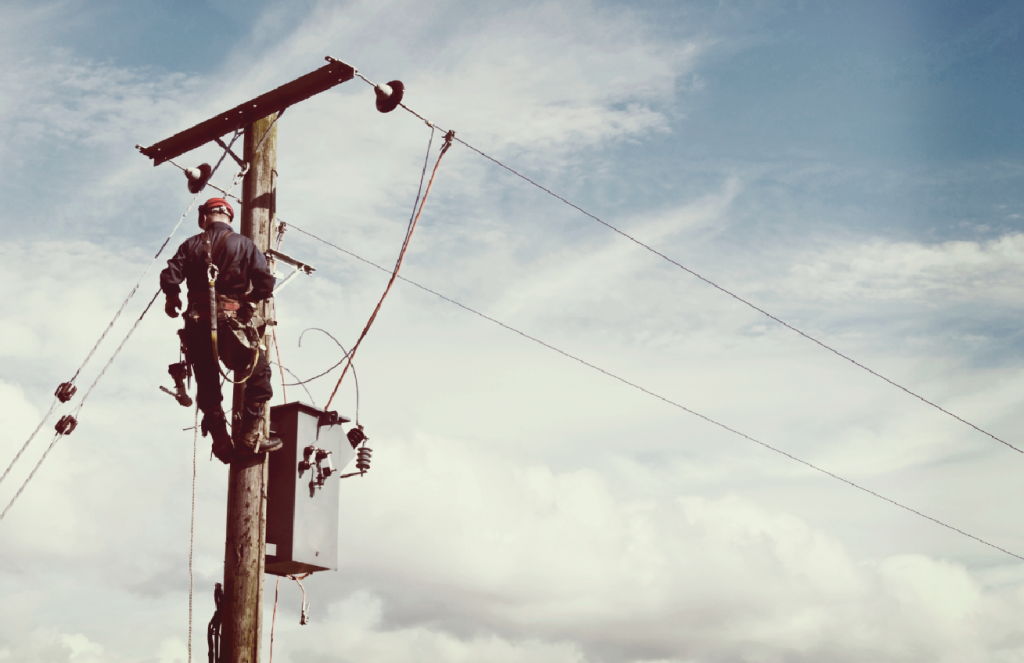 A utility worker at the top of an electric pole - Wabash Valley Power ...